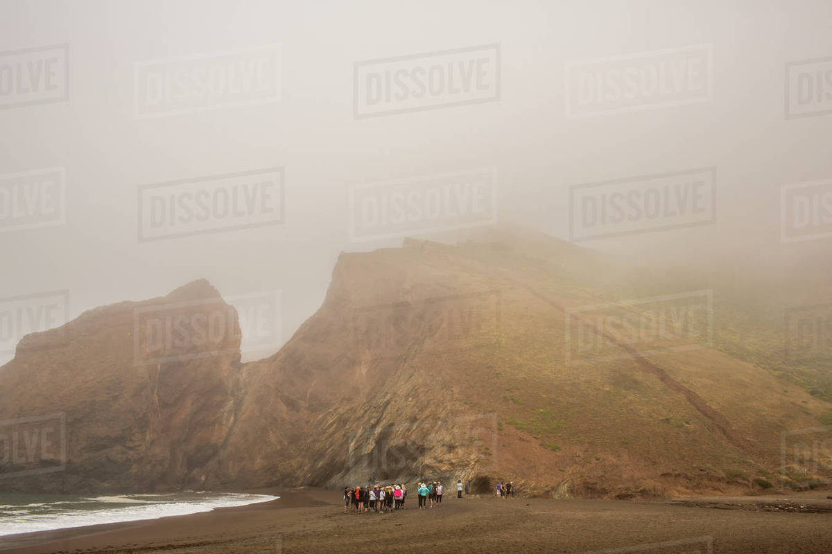 Distant crowd of people standing on beach - Royalty-free Stock Photo ...