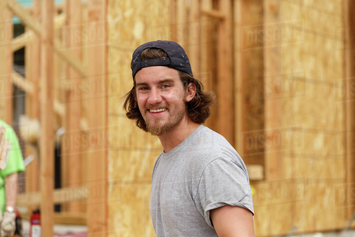 Portrait of smile Caucasian man at construction site - Royalty-free ...