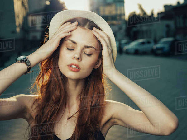 Pensive Caucasian woman with hand in hair - Royalty-free Stock Photo ...