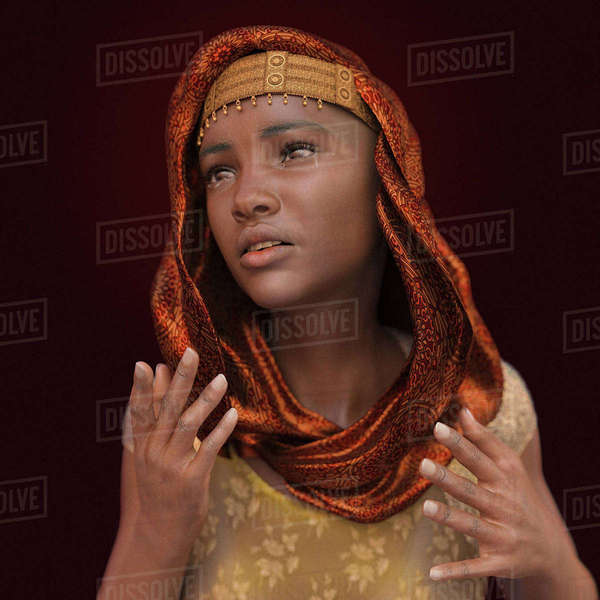 Crying woman wearing headscarf - Royalty-free Stock Photo | Dissolve