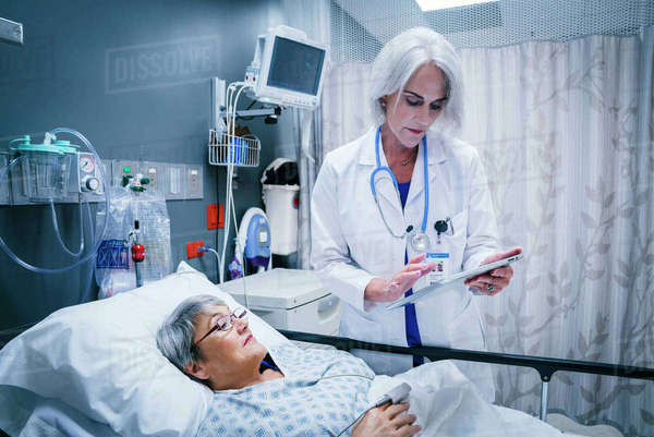 Doctor with digital tablet talking to patient - Royalty-free Stock ...