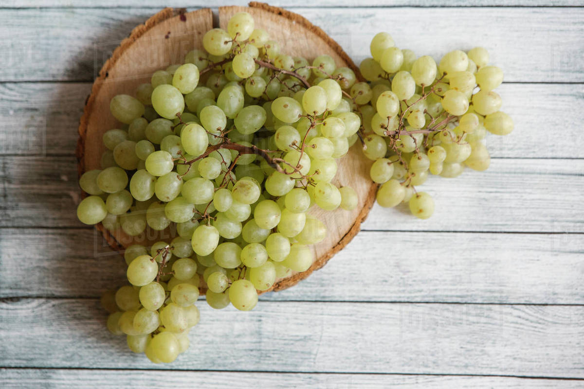 Green grapes on cutting board - Royalty-free Stock Photo | Dissolve