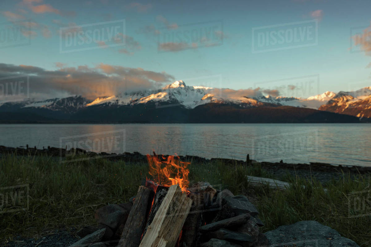 Campfire near mountain river - Royalty-free Stock Photo | Dissolve