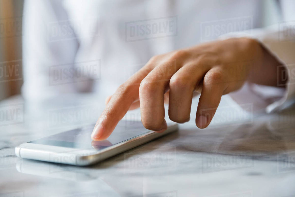 Finger of African American woman using cell phone - Royalty-free Stock ...