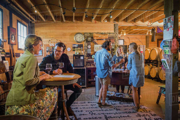 Caucasian people drinking wine in winery - Royalty-free Stock Photo ...