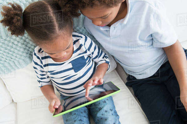 Black children using digital tablet together - Royalty-free Stock Photo ...