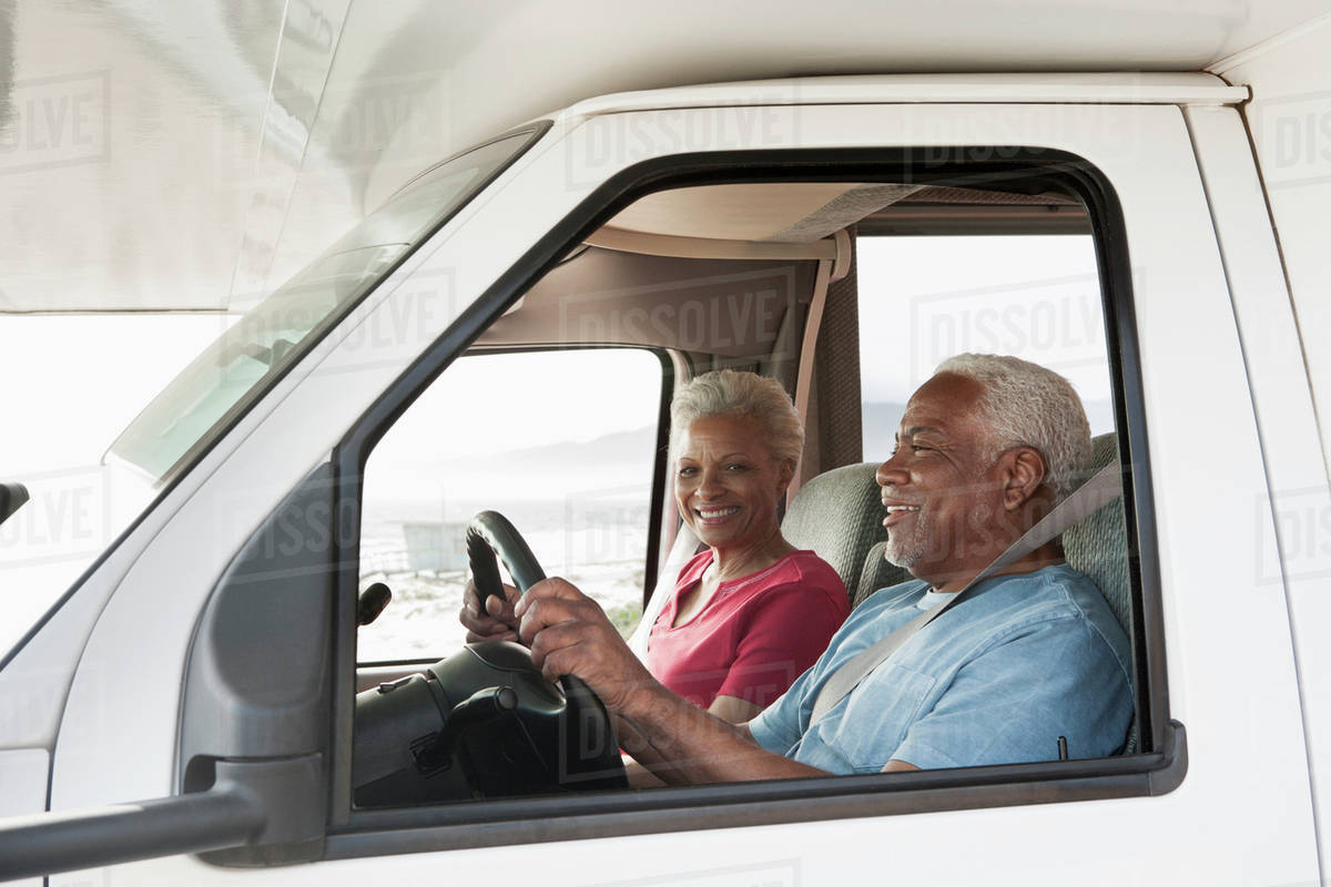 Mixed race Senior couple driving RV - Royalty-free Stock Photo | Dissolve