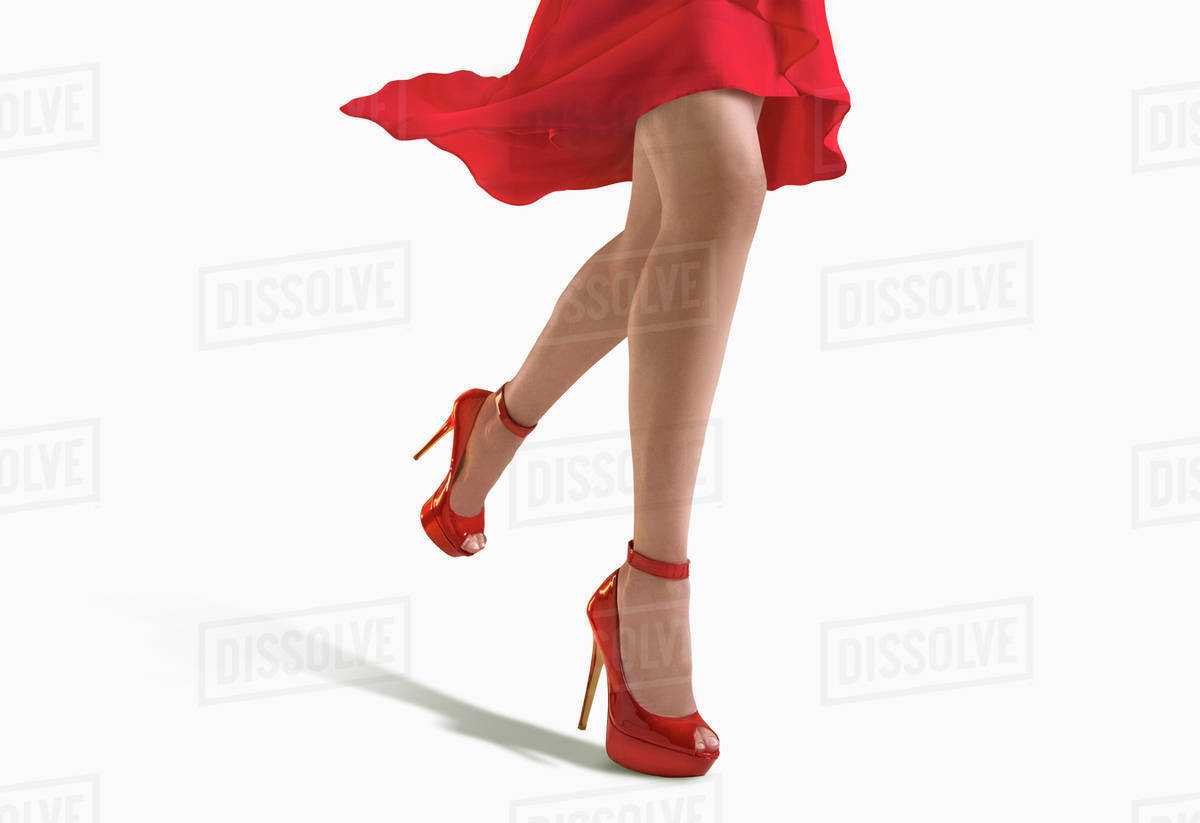 Woman wearing red dress and heels - Stock Photo - Dissolve