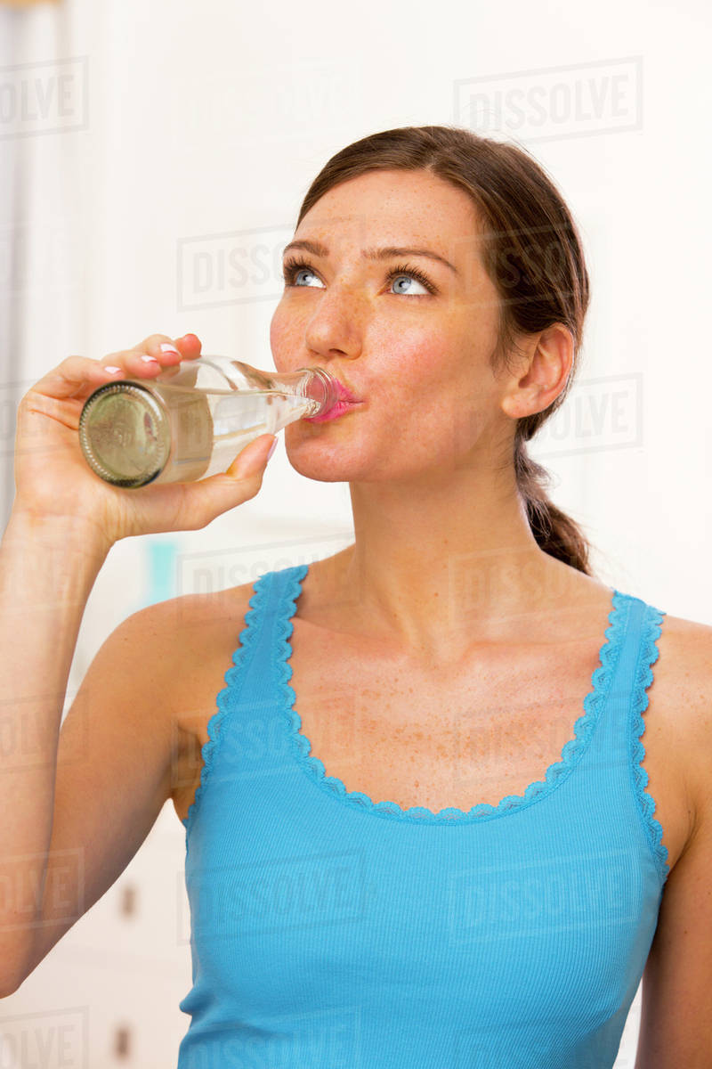 Caucasian woman drinking water - Royalty-free Stock Photo | Dissolve