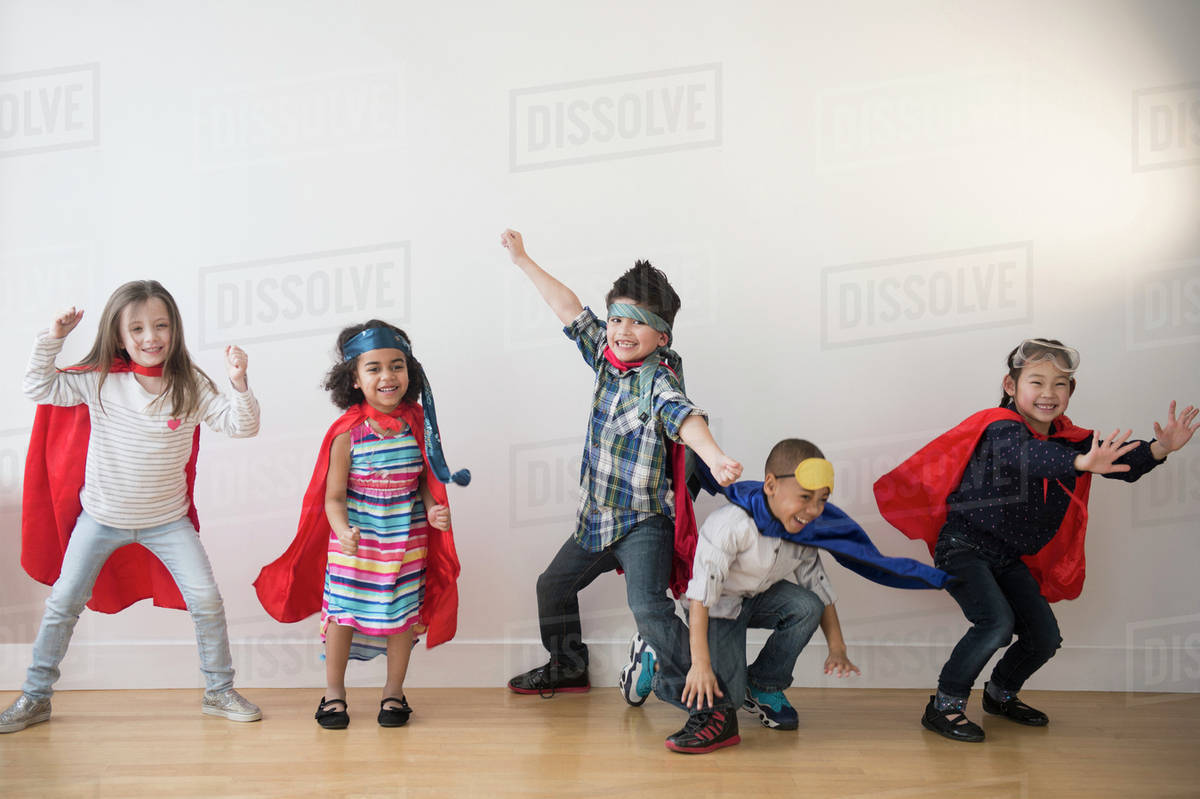 Children playing in capes - Royalty-free Stock Photo | Dissolve
