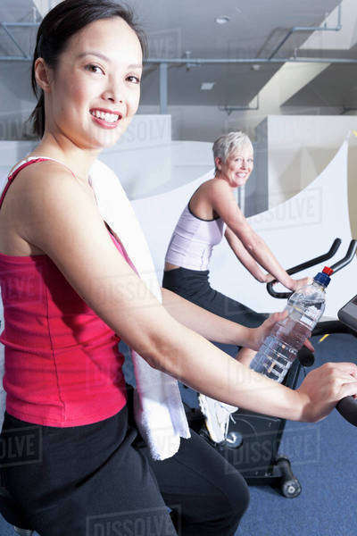 Women using exercise machines in gym - Royalty-free Stock Photo | Dissolve
