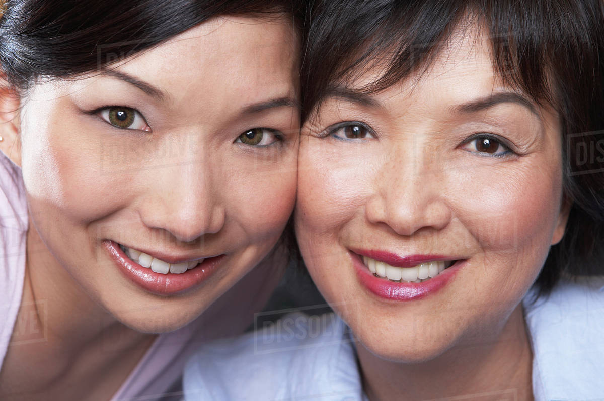 Chinese mother and daughter smiling - Royalty-free Stock Photo | Dissolve