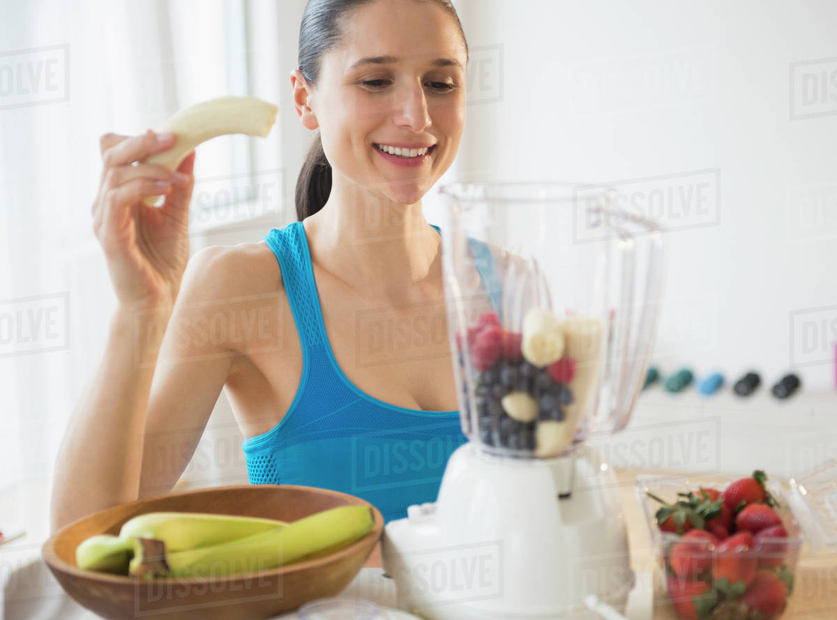 Caucasian woman blending fruit smoothie - Royalty-free Stock Photo ...