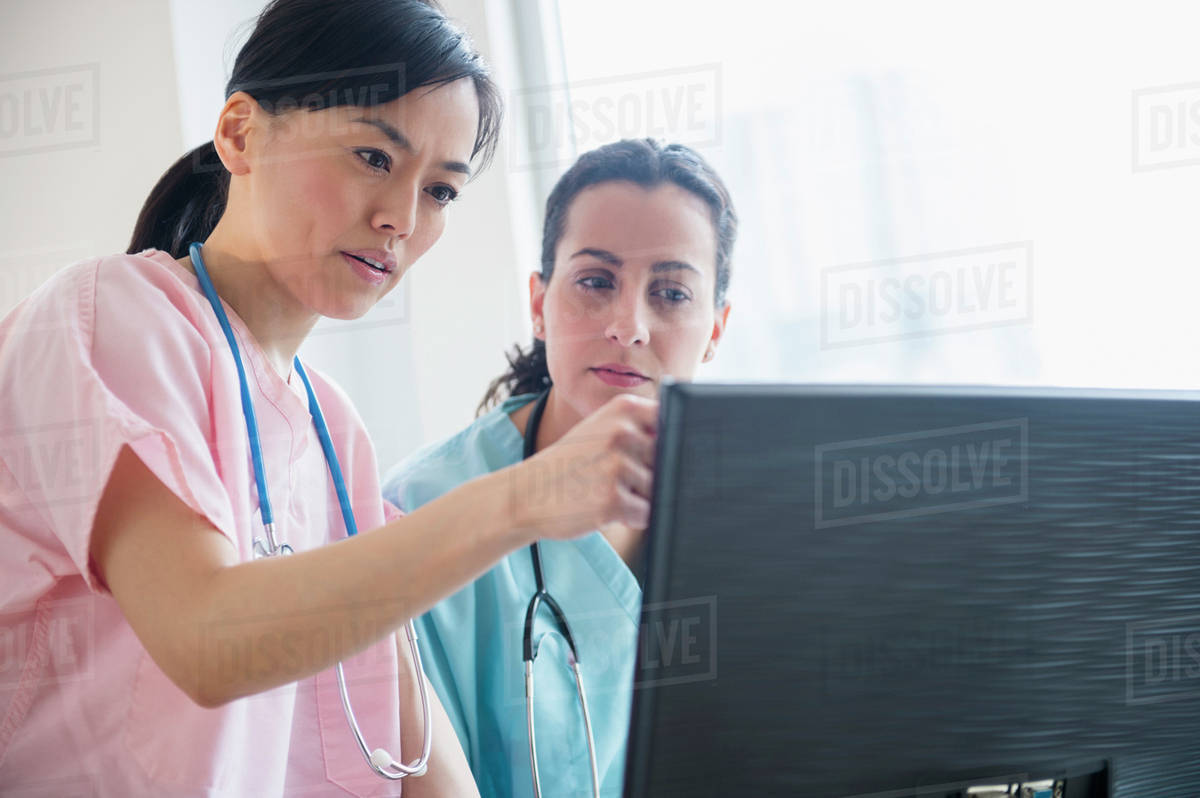 Nurses working together in hospital - Royalty-free Stock Photo | Dissolve