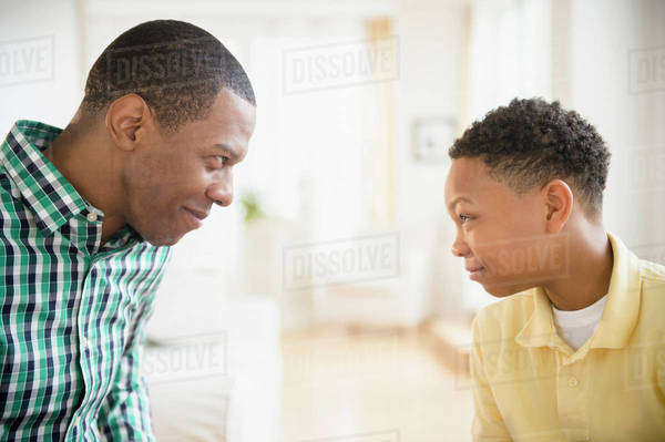 Father and son making faces at each other - Royalty-free Stock Photo ...