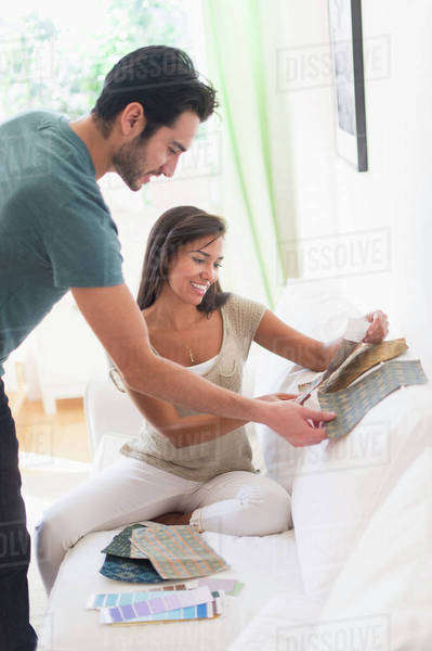 Couple picking out fabric swatches together - Royalty-free Stock Photo ...