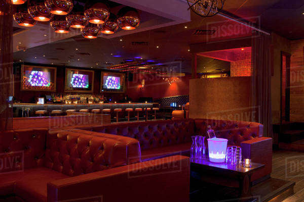 Tables and booths in empty nightclub - Royalty-free Stock Photo | Dissolve