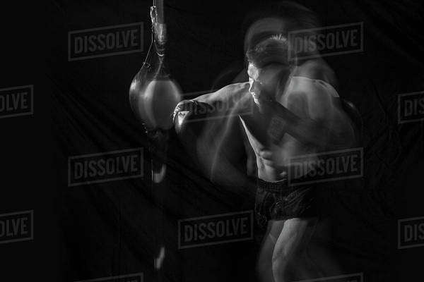 Blurred view of Caucasian boxer training - Stock Photo - Dissolve