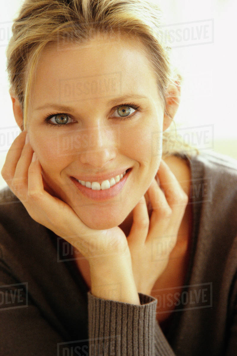 Close up of woman's smiling face - Stock Photo - Dissolve