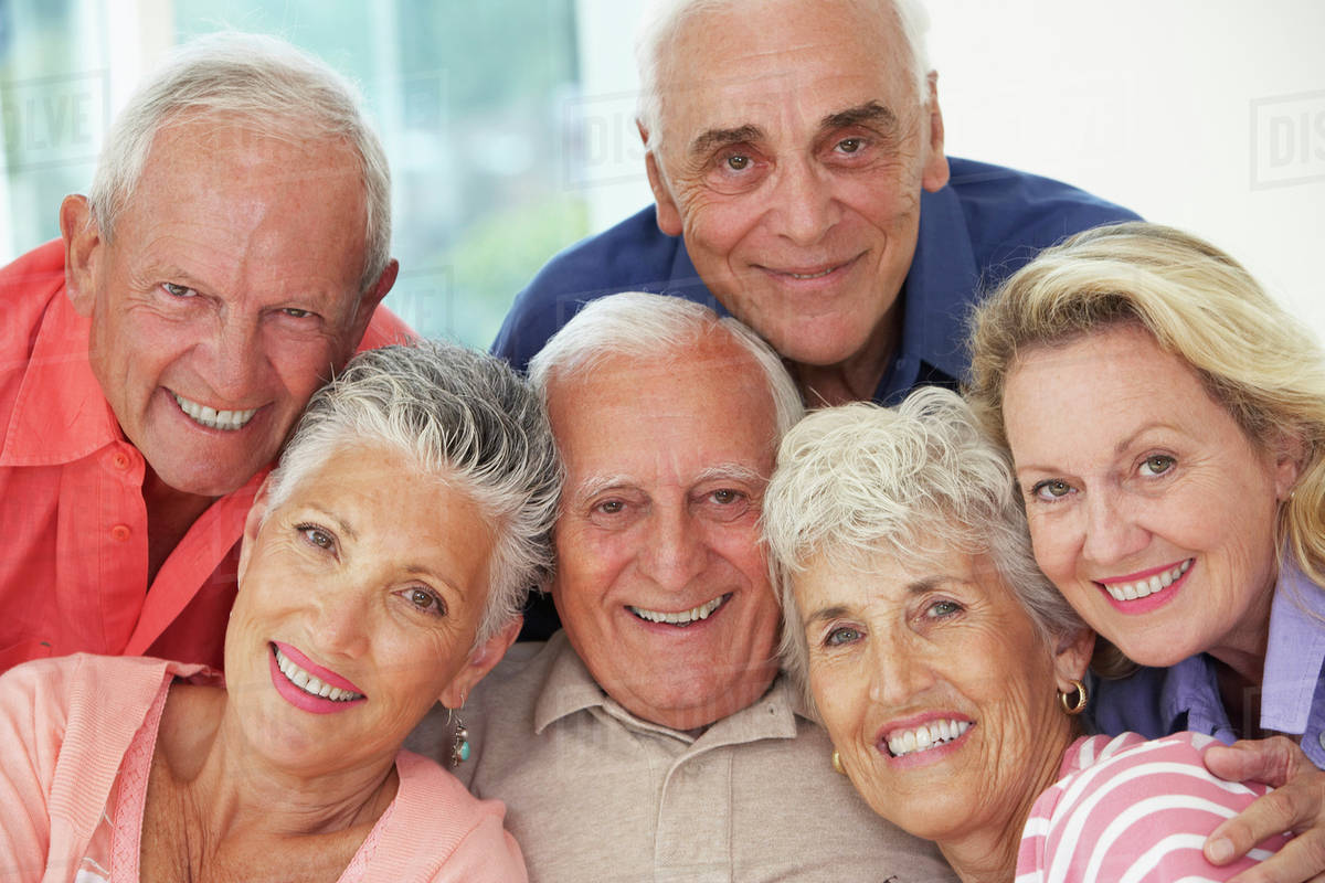 Senior friends smiling together - Royalty-free Stock Photo | Dissolve