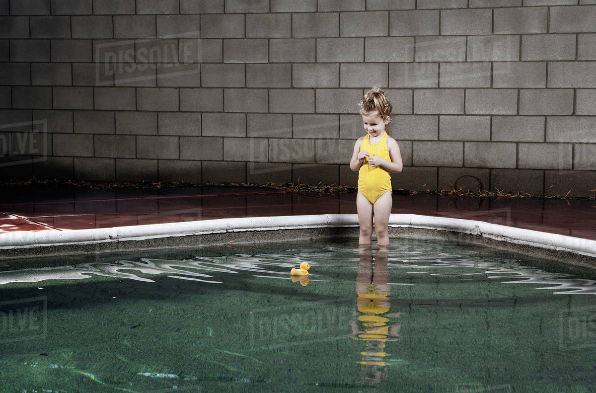 Caucasian girl standing in swimming pool - Royalty-free Stock Photo ...
