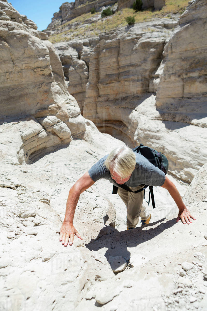 Older Caucasian man climbing rock formations - Royalty-free Stock Photo ...