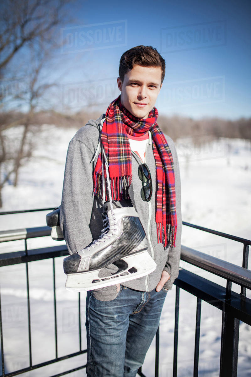 Caucasian man carrying ice skates in winter - Royalty-free Stock Photo ...