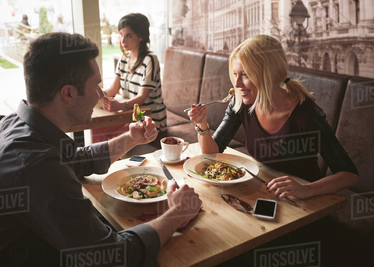 Couple eating in cafe - Stock Photo - Dissolve