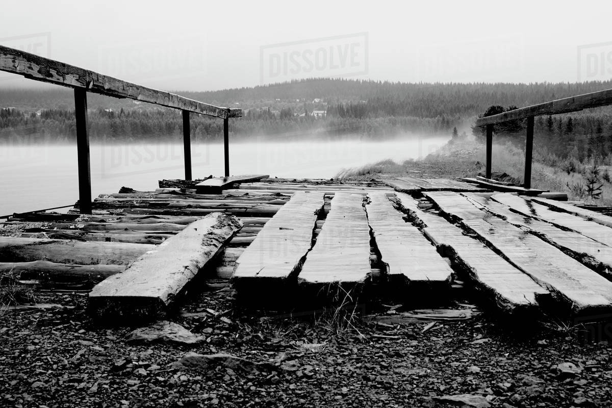 Wooden planks on platform on beach - Royalty-free Stock Photo | Dissolve
