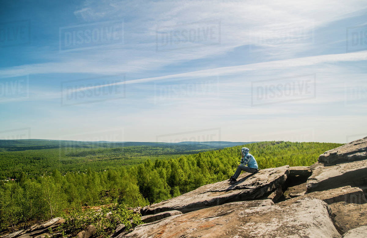 Caucasian climber sitting on rock formation - Royalty-free Stock Photo ...