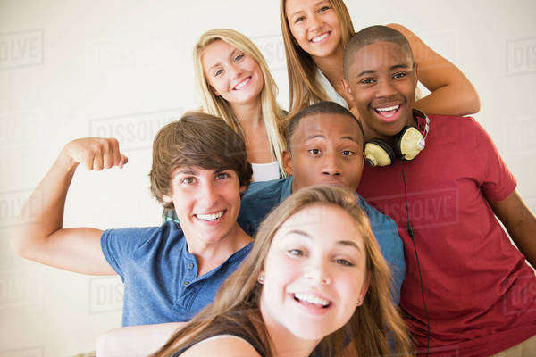 Teenagers smiling together - Royalty-free Stock Photo | Dissolve
