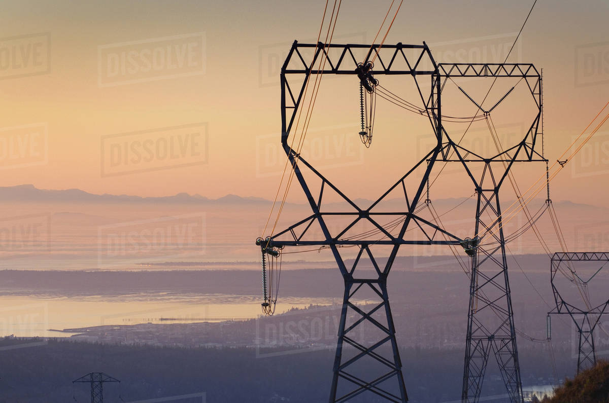 Silhouette of power lines at sunset - Royalty-free Stock Photo | Dissolve