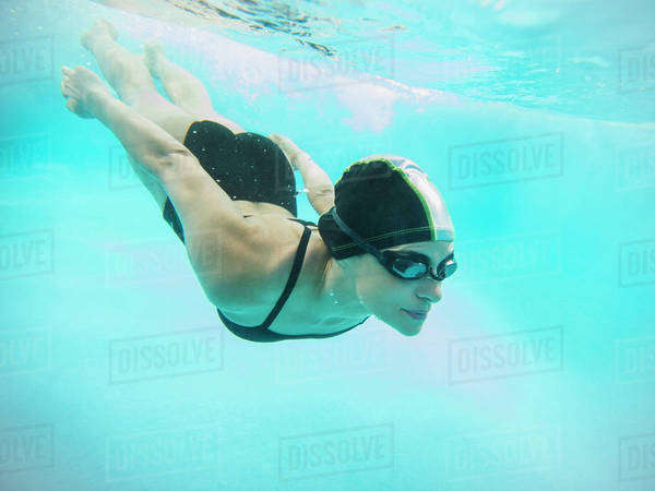 Caucasian swimmer diving into swimming pool - Royalty-free Stock Photo ...