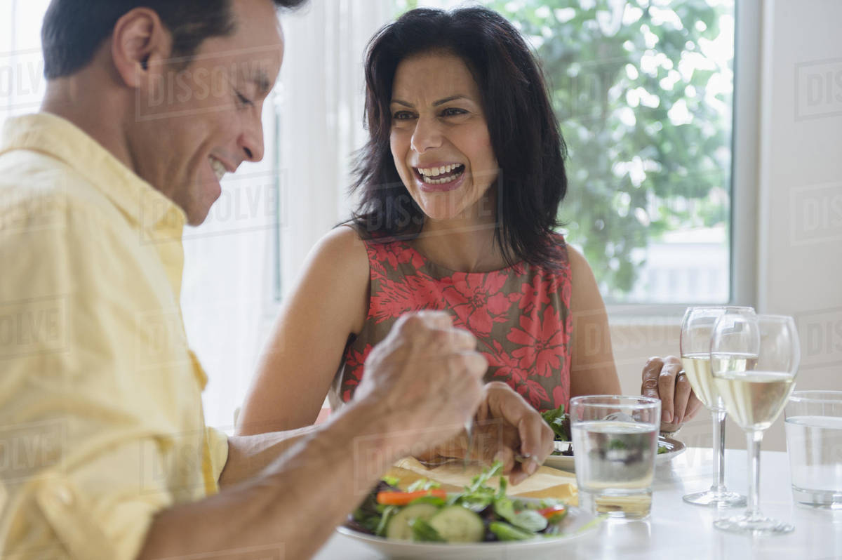 Couple eating lunch in restaurant - Royalty-free Stock Photo | Dissolve