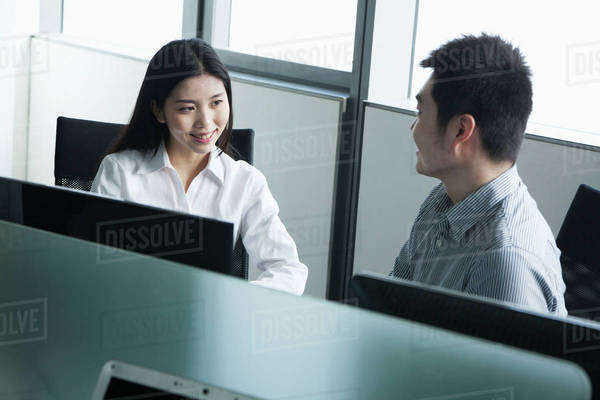Chinese business people working in office - Stock Photo - Dissolve