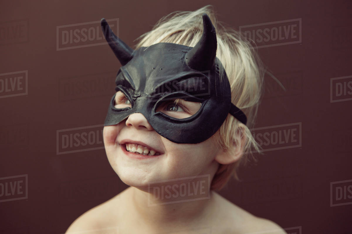 Caucasian boy wearing mask - Stock Photo - Dissolve