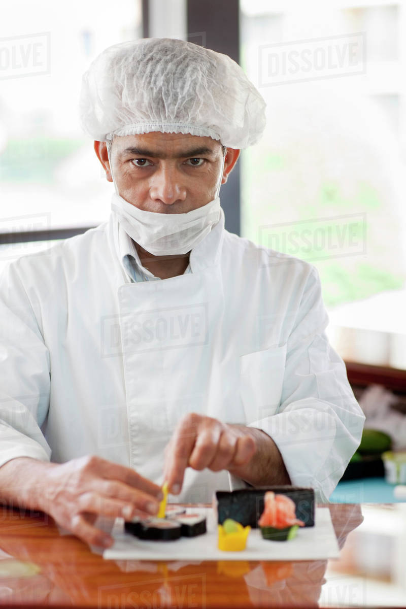 Hispanic chef preparing sushi in restaurant - Royalty-free Stock Photo ...