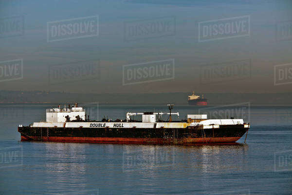 Shipping Vessel Floating in Water - Royalty-free Stock Photo | Dissolve