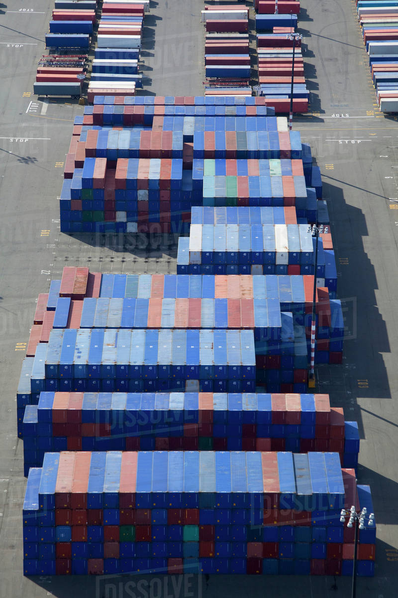Cargo containers stacked at commercial dock - Stock Photo - Dissolve