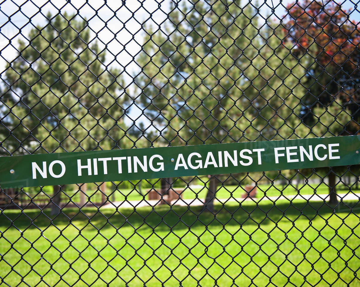 Warning Sign on Chain Fence - Royalty-free Stock Photo | Dissolve