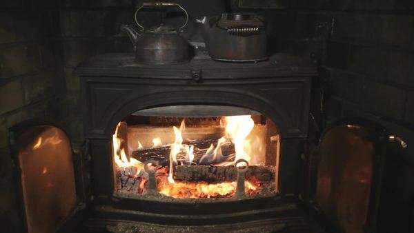 Fire burning in old-fashioned stove - Stock Video Footage - Dissolve