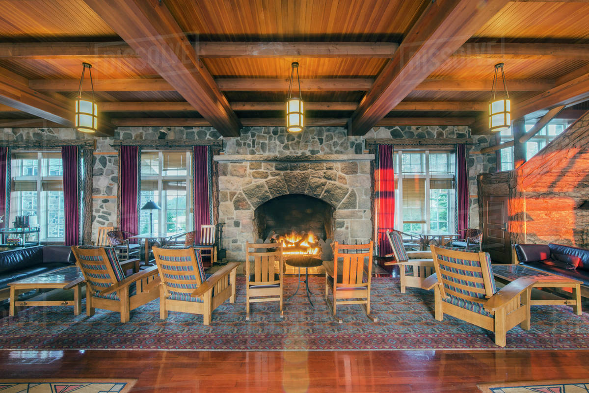 Rustic fireplace and sitting area in hotel - Royalty-free Stock Photo ...