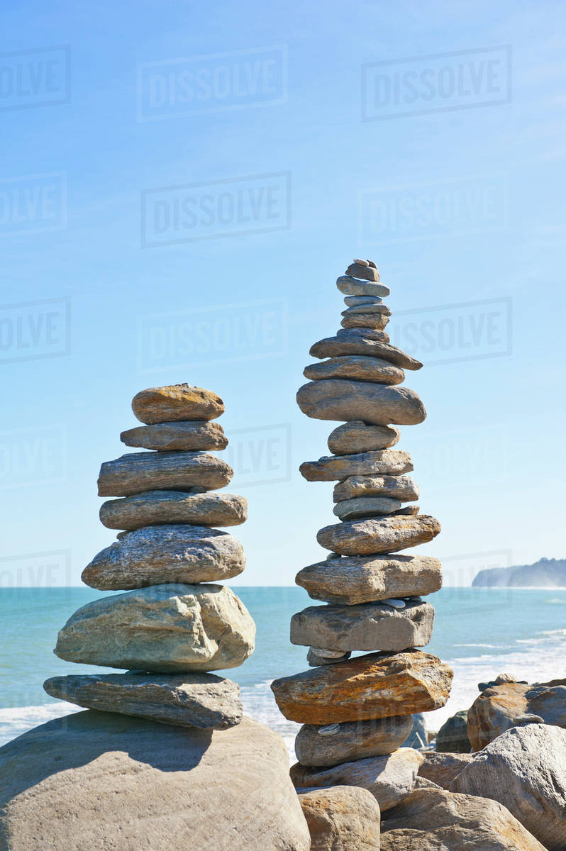 Stacked stones on beach - Stock Photo - Dissolve