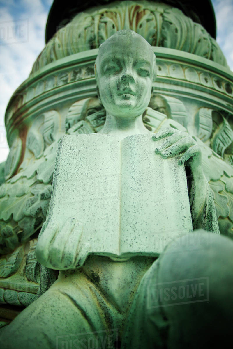 A human figure holding a book open - Royalty-free Stock Photo | Dissolve