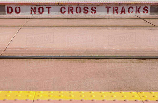Do Not Cross Tracks sign at Light rail train station - Royalty-free ...