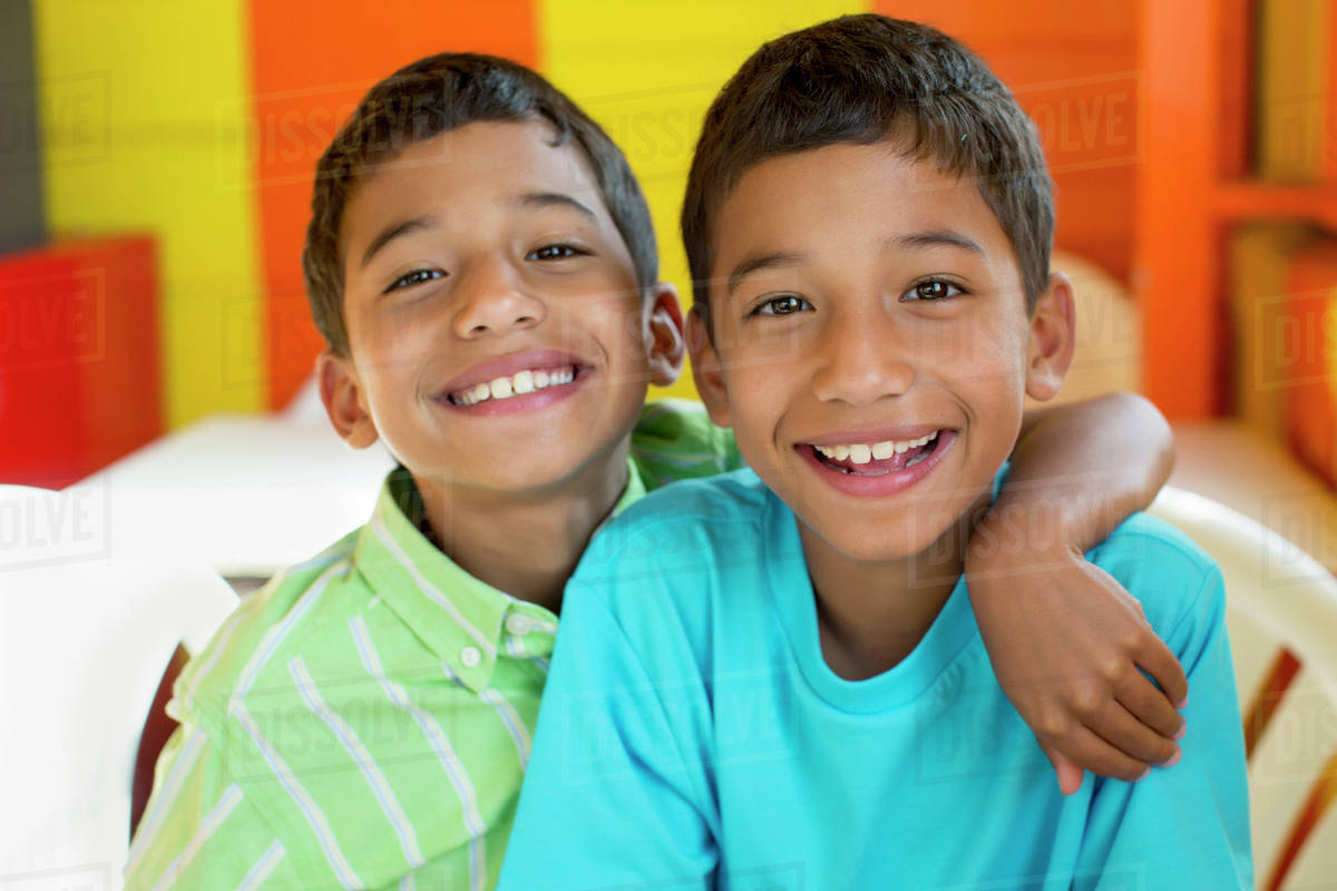 Hispanic boys smiling together - Royalty-free Stock Photo | Dissolve
