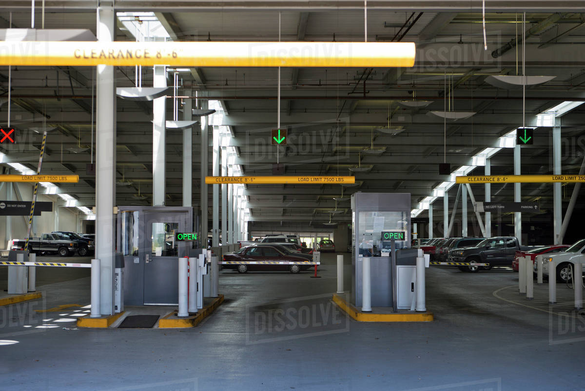Toll booths at entrance to parking garage - Stock Photo - Dissolve