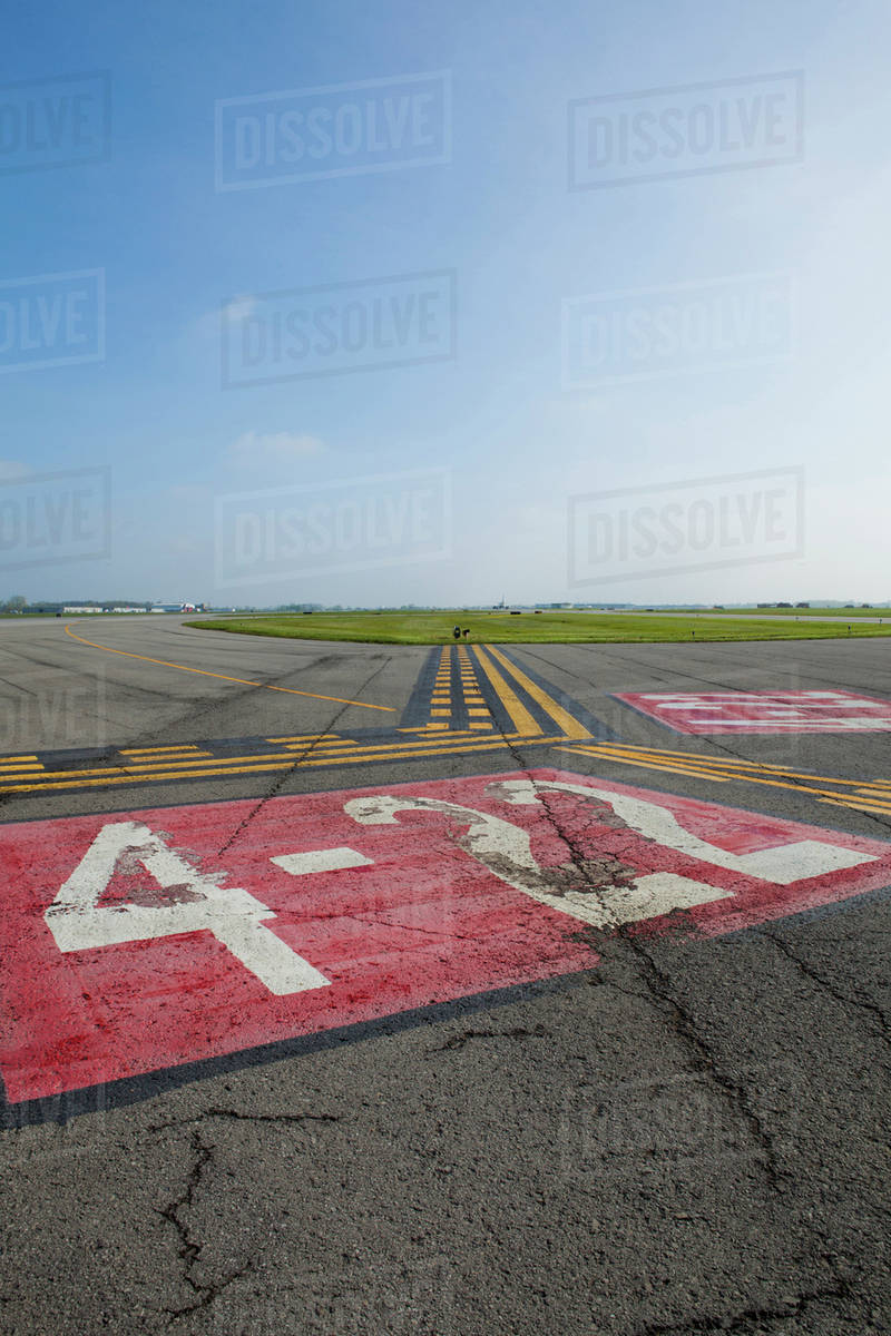 Markings on airplane runway - Stock Photo - Dissolve