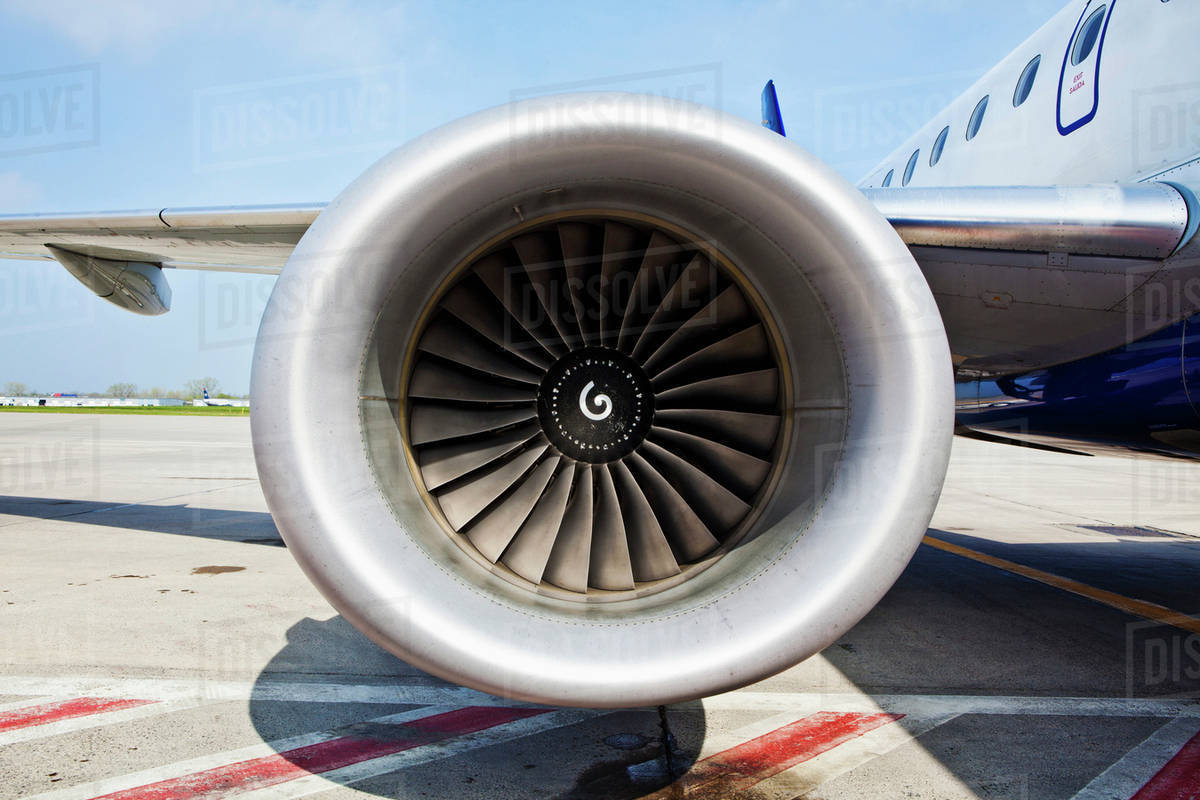 Close up of airplane jet engine on runway - Stock Photo - Dissolve