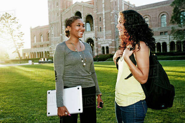 Professor and student talking on campus - Royalty-free Stock Photo ...